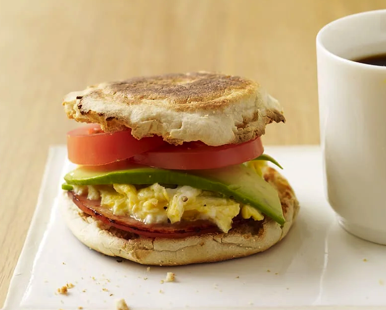Egg and Canadian bacon sandwiches with avocado and tomato