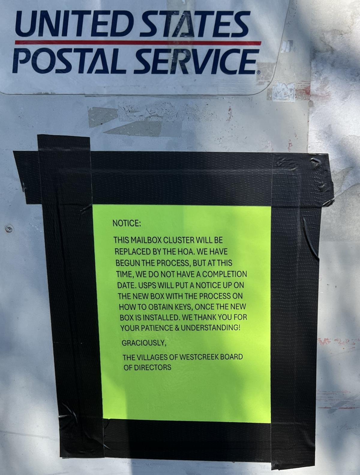 Image of USPS Mailbox with notice posted on the side informing that ...