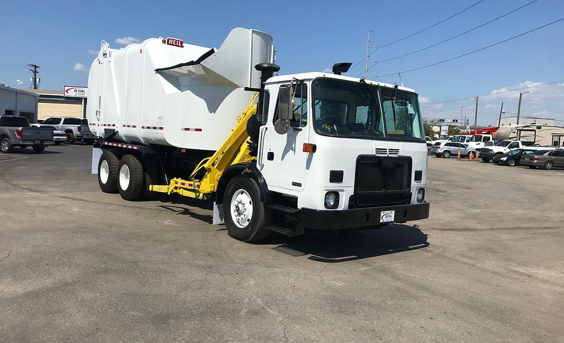 Hook Lifts and Rear Loaders! Drive one home Today!